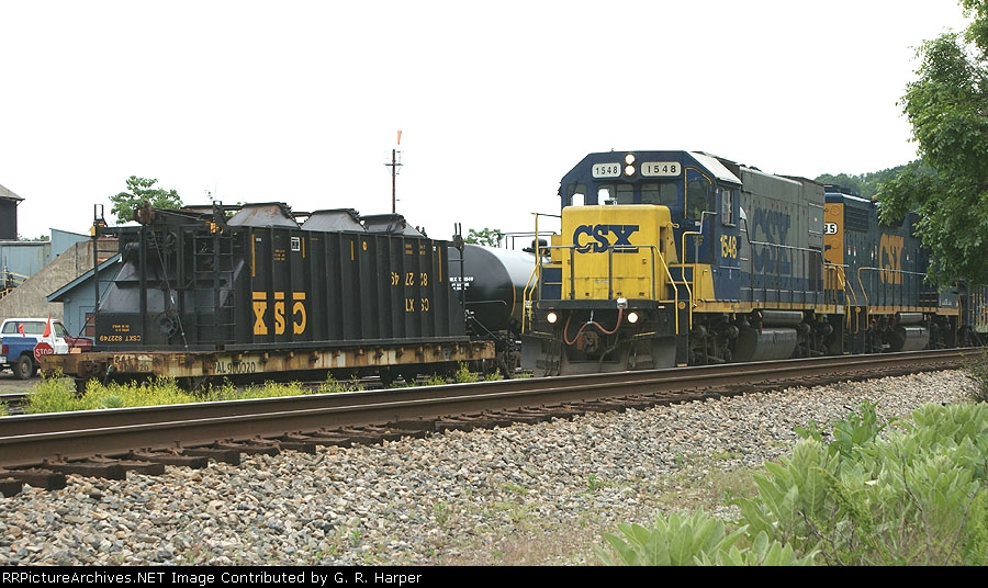323 - GP15 on the H74421 eases past unusual load at the BRC Rail Car Facility